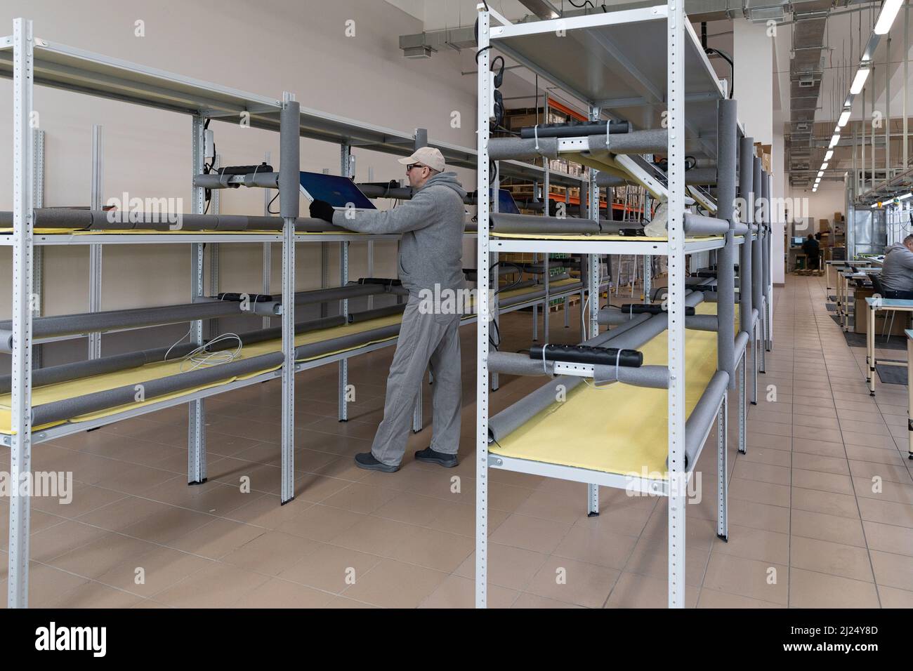 Photo of a man in a gray suit checking the computer at work. Testing ...