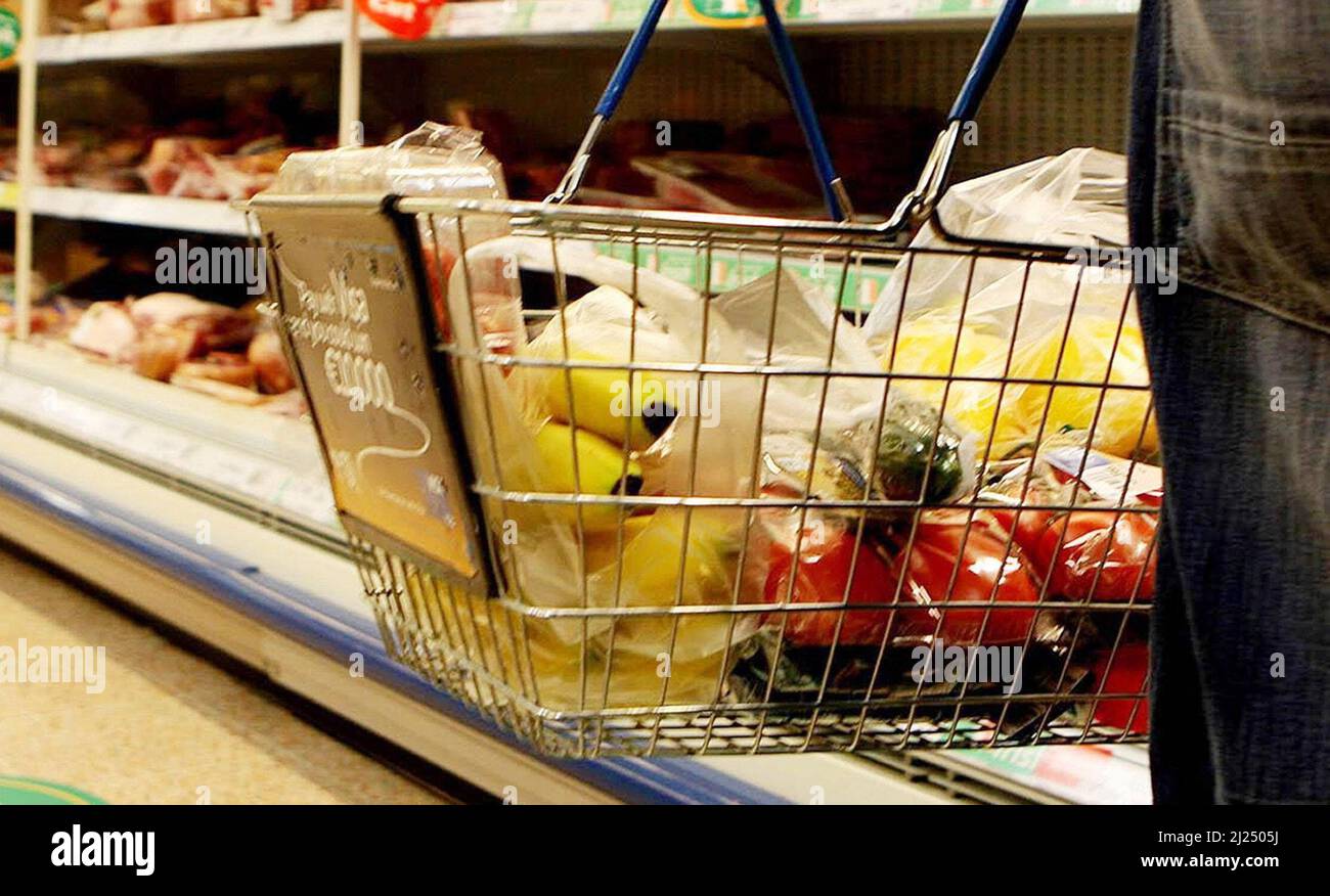 File photo dated 22/07/09 of a shopper in a supermarket. Shop price ...