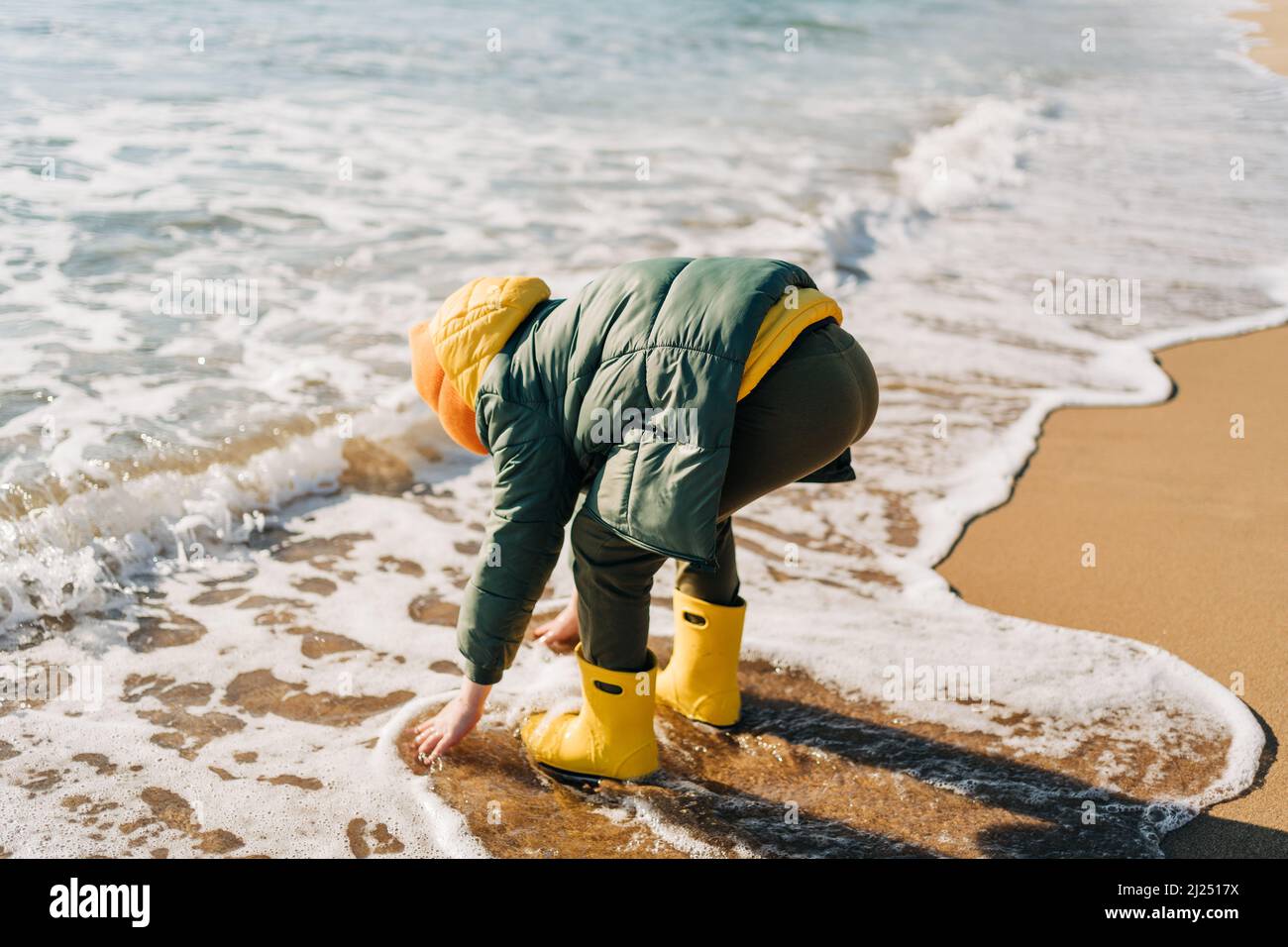 Child touching water hi-res stock photography and images - Alamy