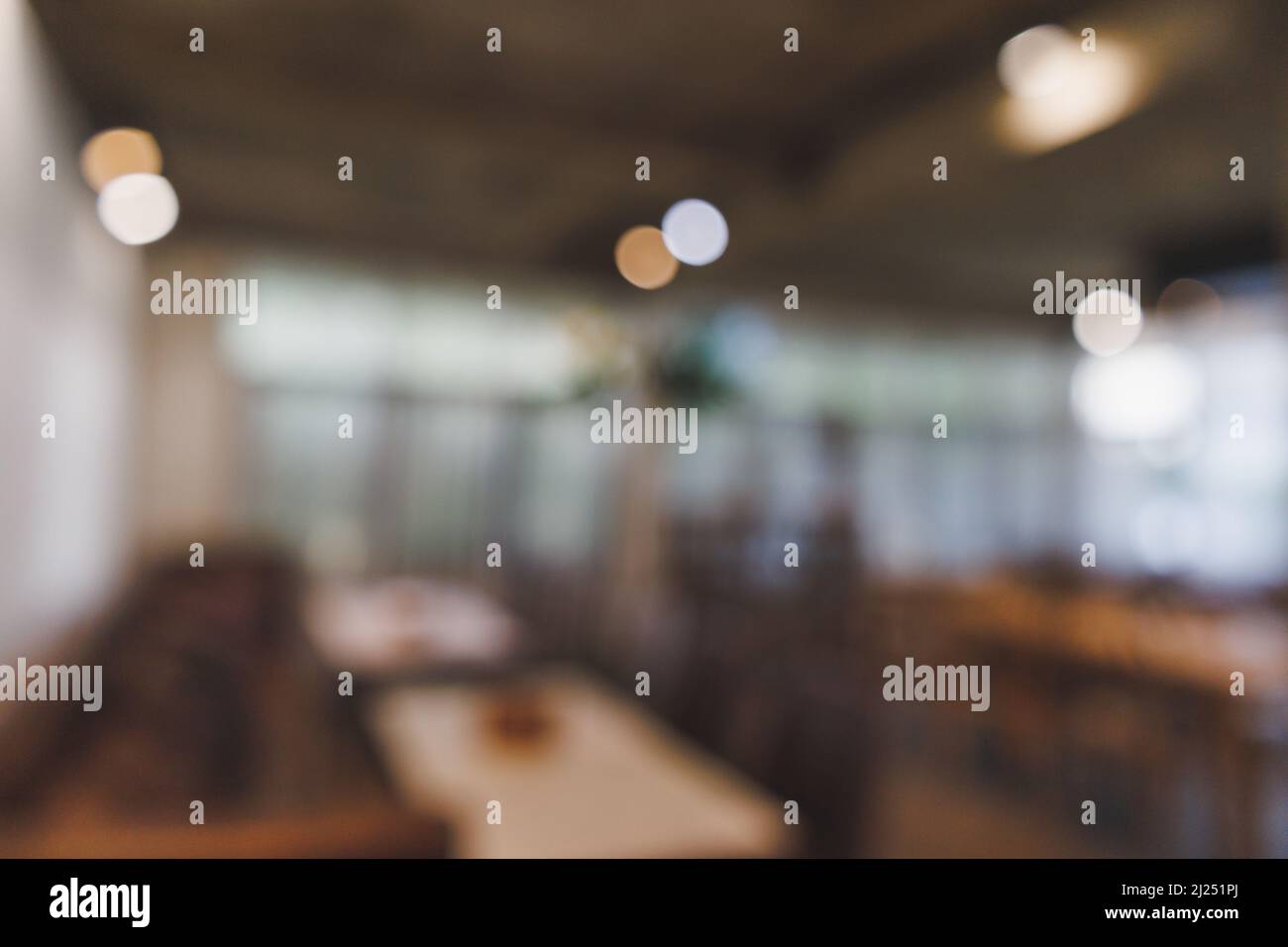 Blur coffee shop or cafe restaurant interior a loft style open coffee ...