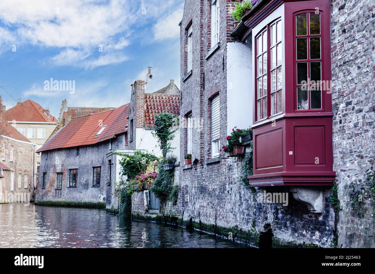 Bruges, Belgium; view of the medieval buildings that are crossed by the ...
