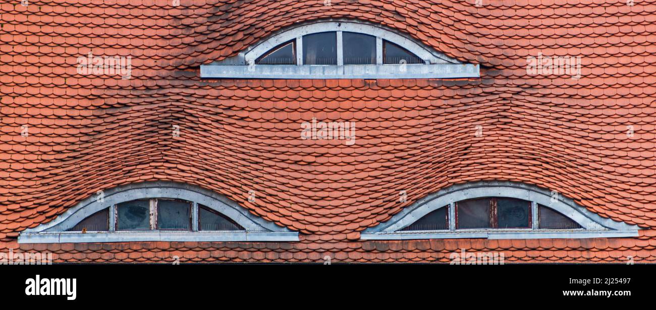 Eye-like Windows in a Tiled Roof Stock Photo - Alamy