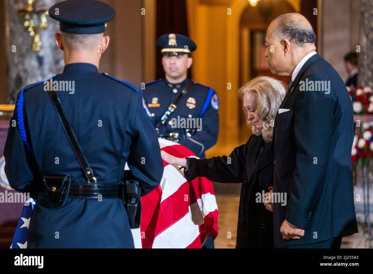 Anne Walton pauses at the casket of her late husband Republican ...