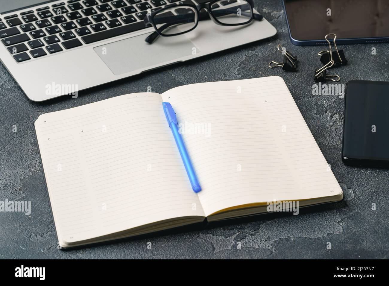 Blank notebook with pen are on top of office desk table Stock Photo - Alamy