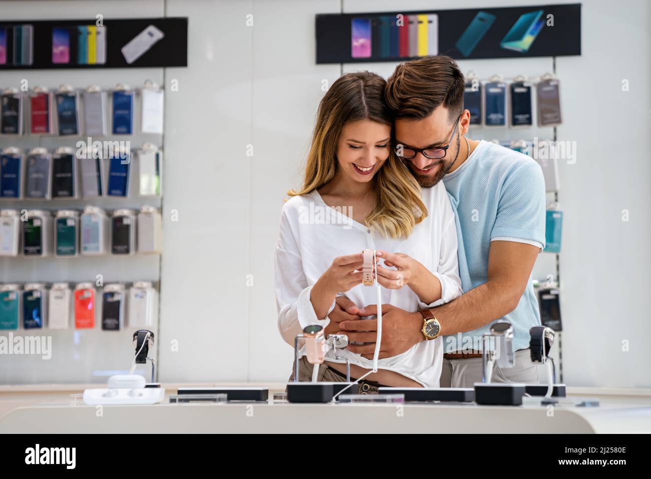 Technology people smart devices concept. Happy couple buying new smart ...