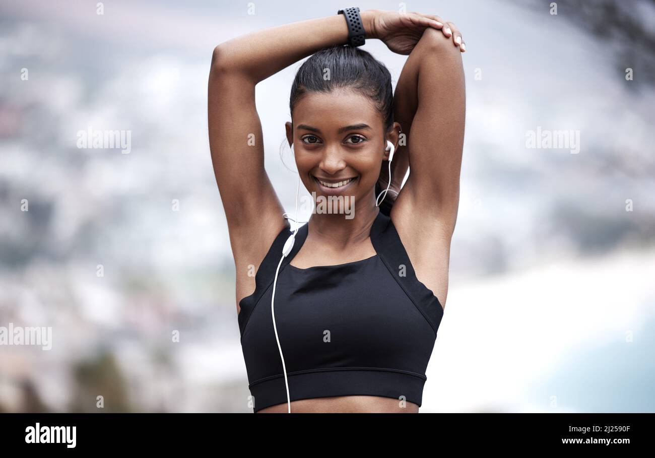 Every stretch is important for a good workout. Portrait of a sporty ...