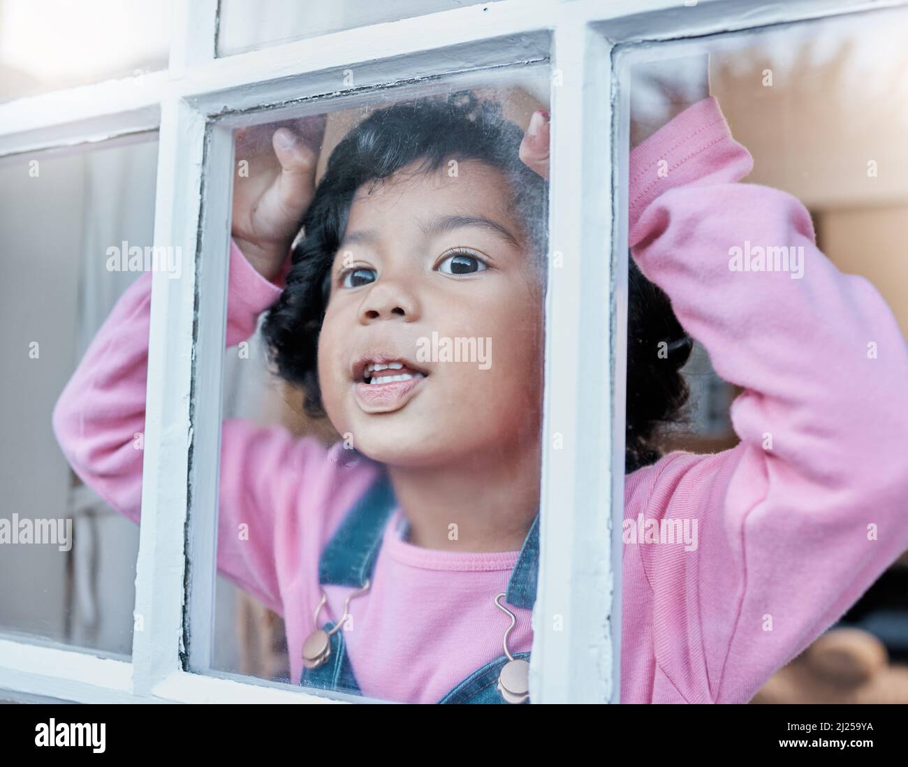I dont see any of my friends outside. Shot of an adorable little girl ...