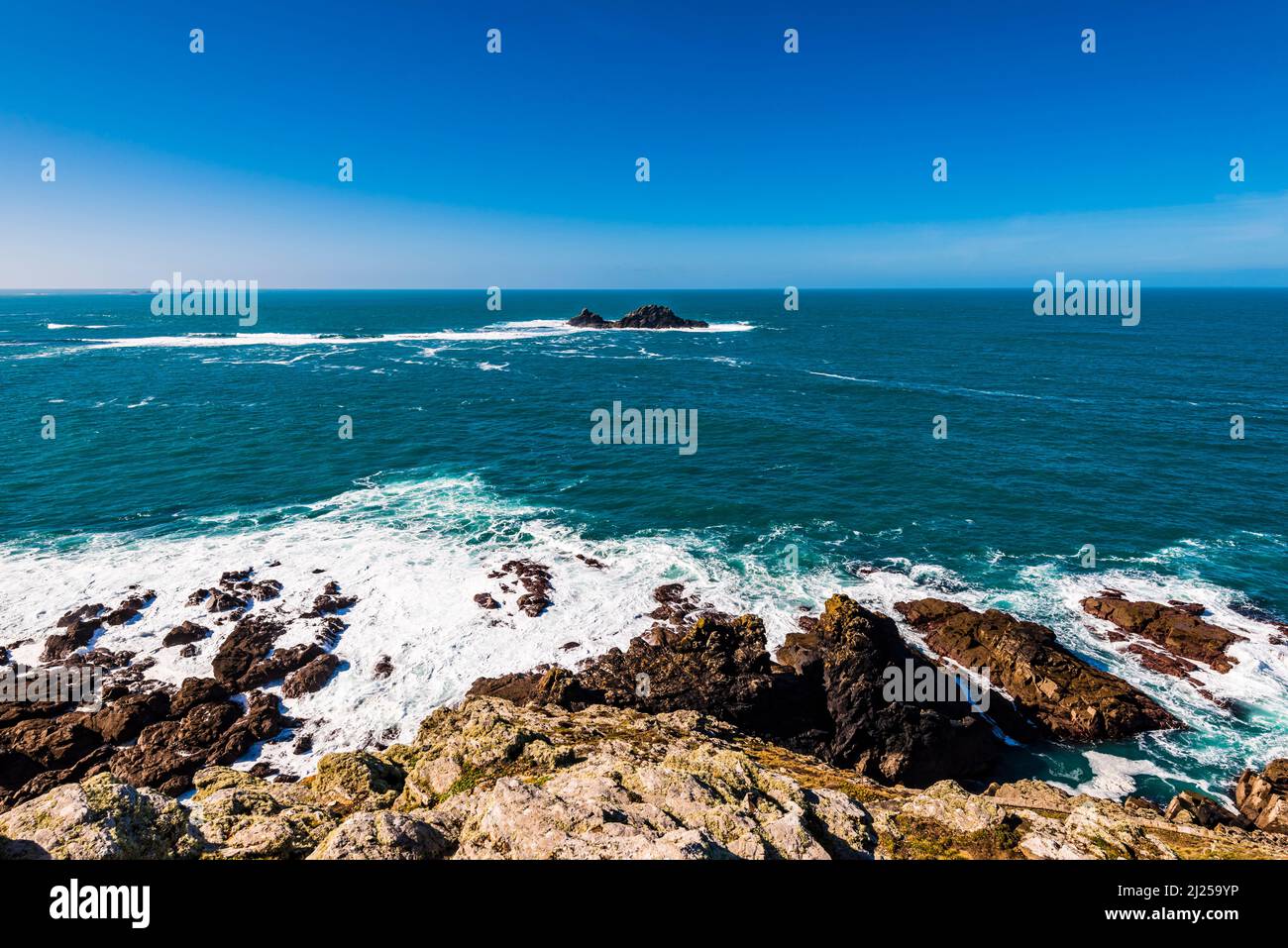 Looking out to The Brisons rocks and the Longships Lighthouse at Cape ...