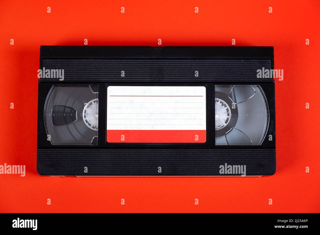Retro Video Tape Cassette on a Red Paper Background Stock Photo - Alamy
