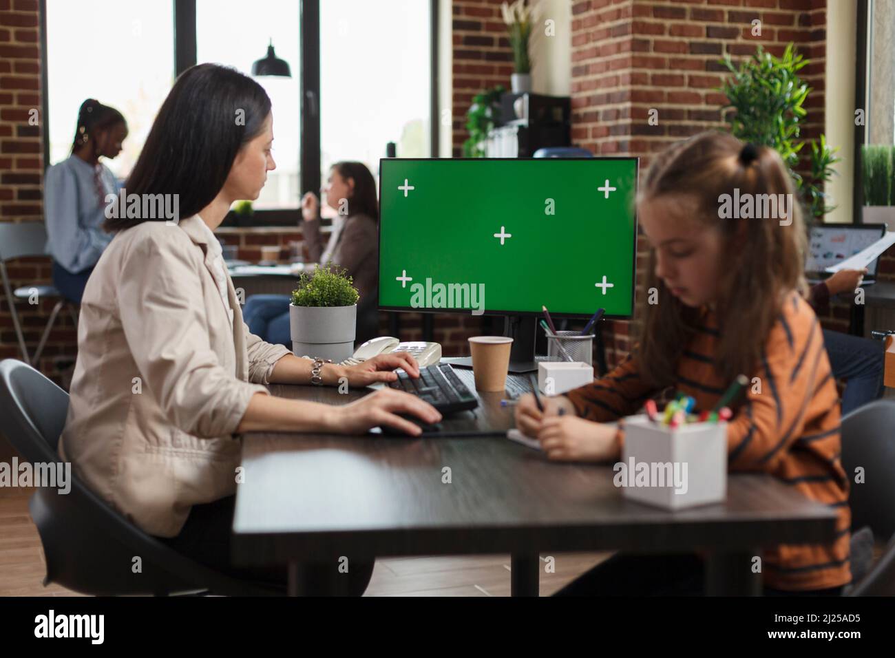Working businesswoman using greenscreen on computer in agency office ...