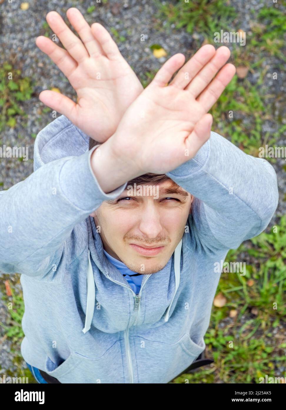 Upper view of Serious Young Man show a Refusal Gesture with a Hands ...