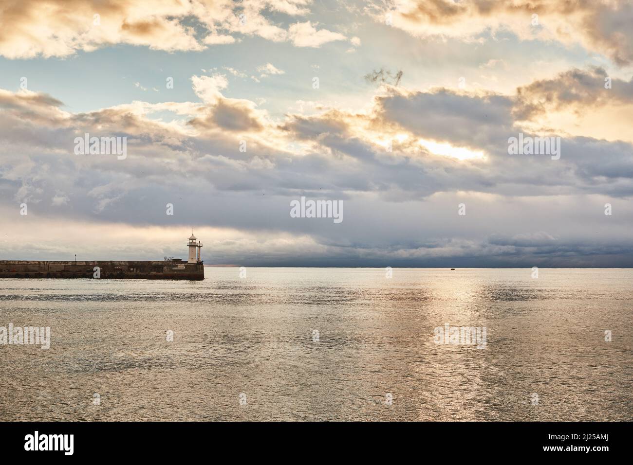 Sea embankment and lighthouse in the city of Yalta. Black Sea. Front ...