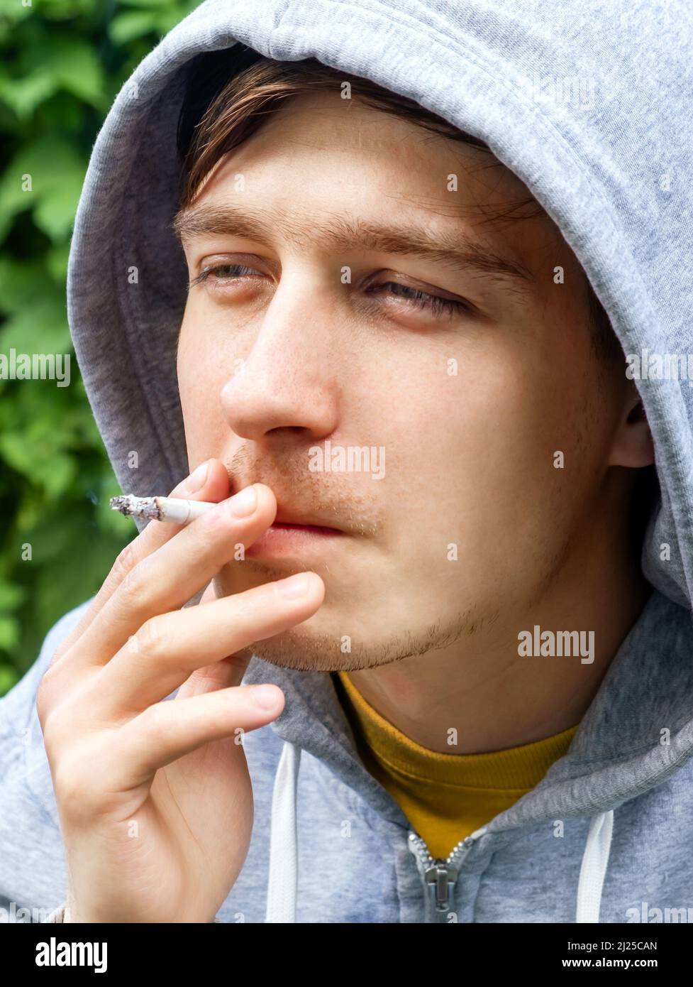 Smoking male teenager portrait hi-res stock photography and images - Alamy