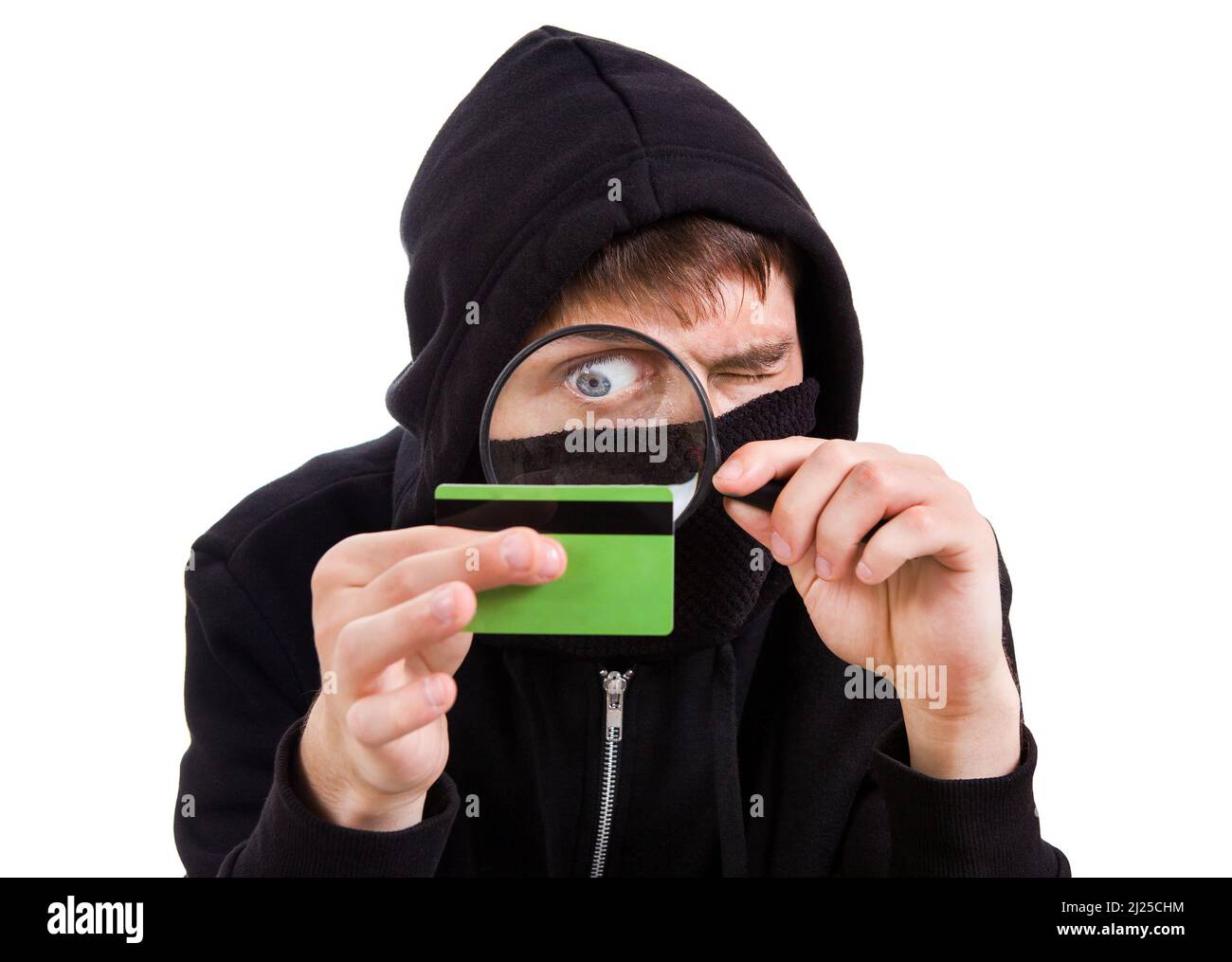 Hacker with a Bank Card using a Magnifying Glass on the White ...