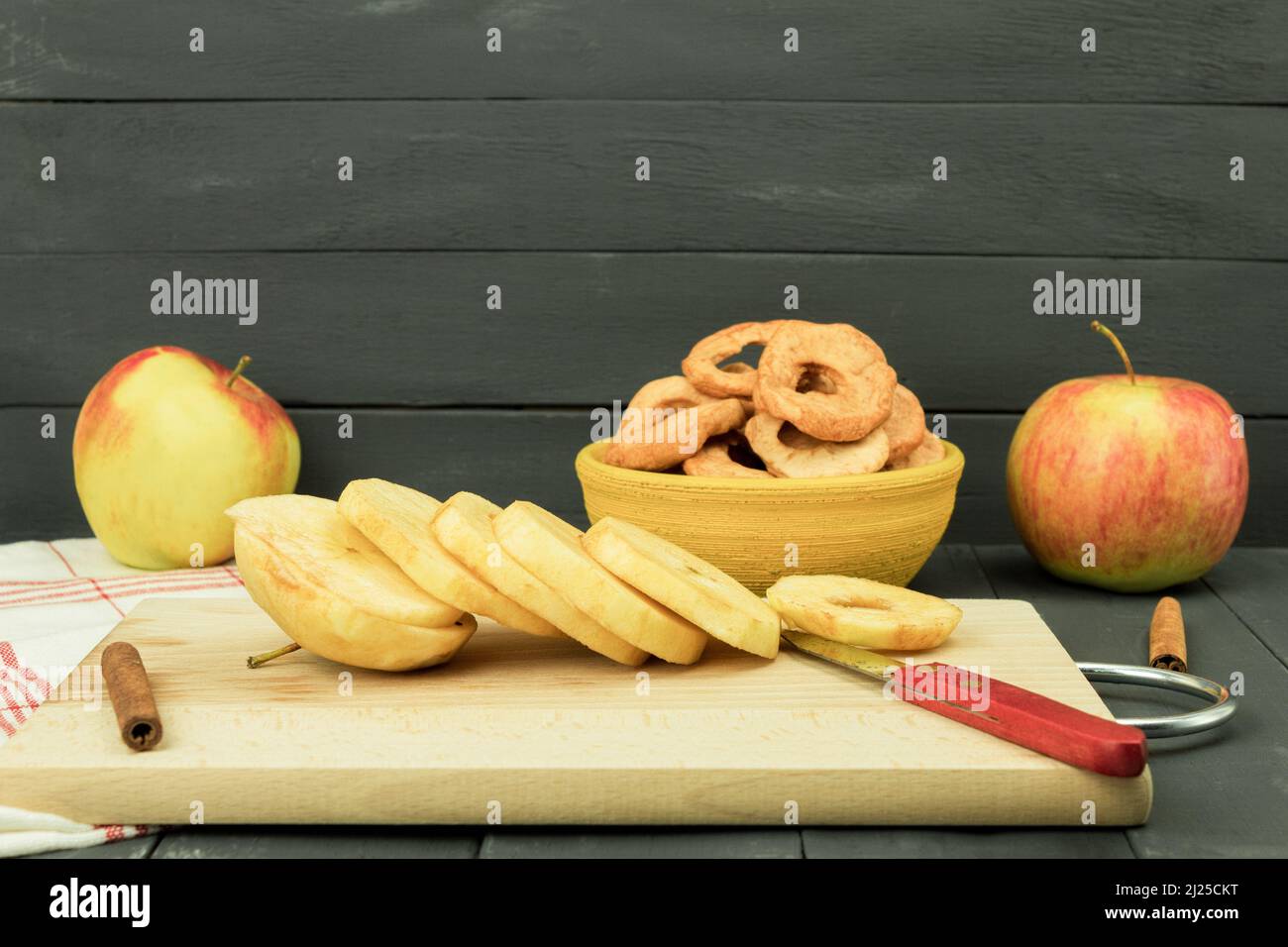 Peeled ripe red apple on a kitchen countertop, side view. Background ...