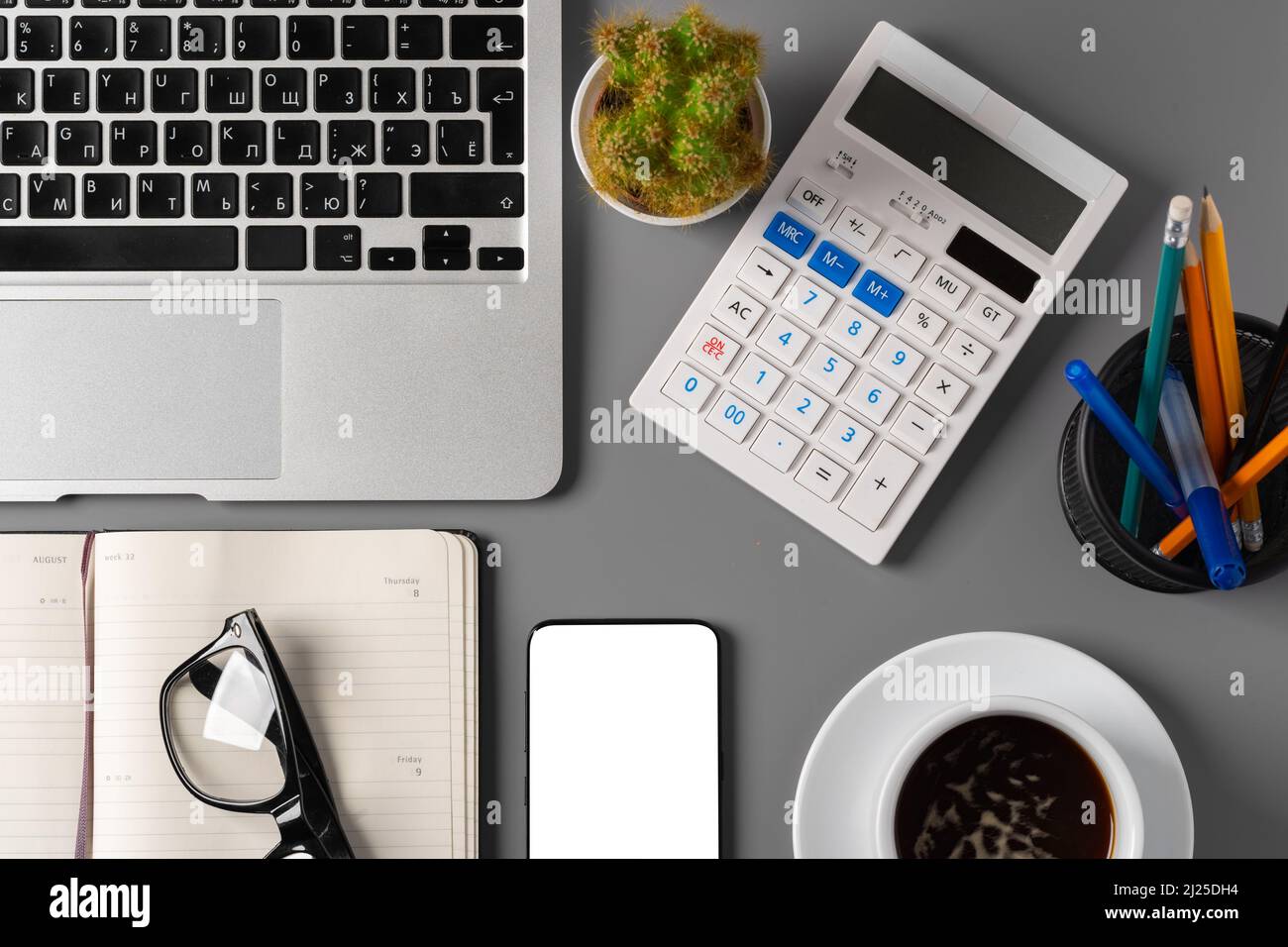 Notepad is on top of office desk table with laptop and supplies Stock ...
