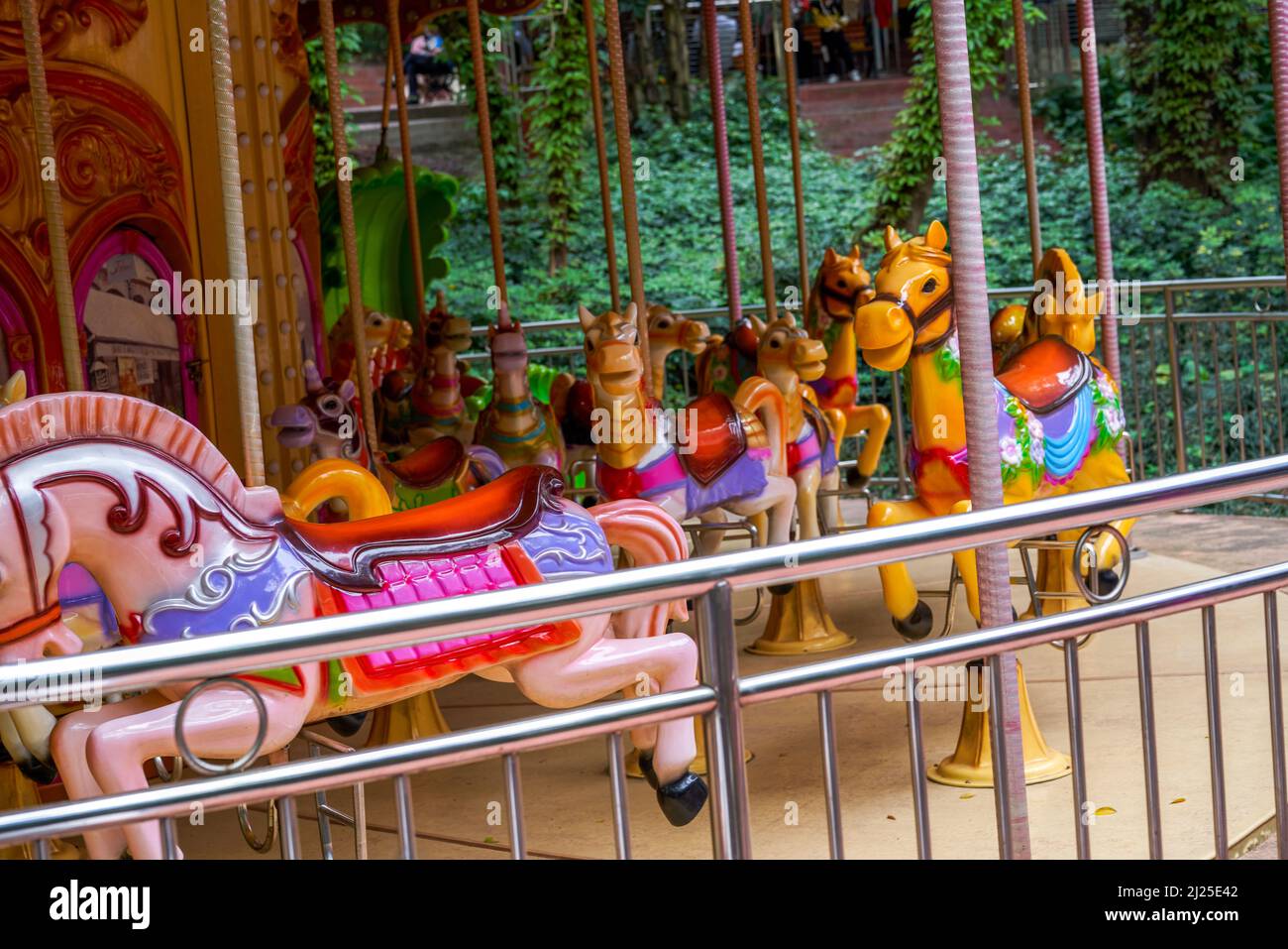 Close-up of carousel in children's playground Stock Photo - Alamy