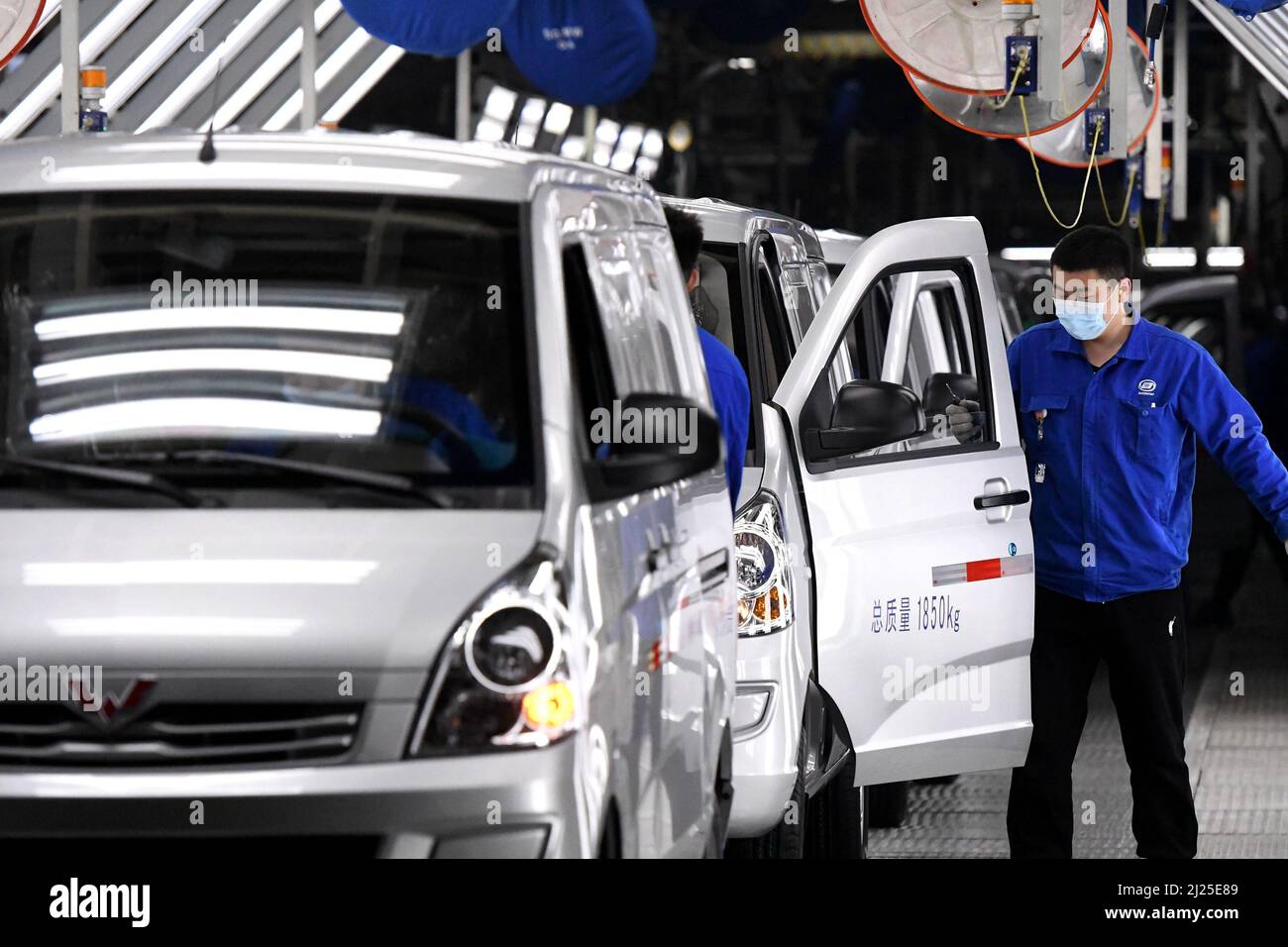 QINGDAO, CHINA - MARCH 30, 2022 - A worker checks the quality of new ...