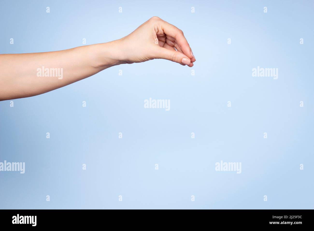 Woman hand gesture. Female hand pose like holding or picking something ...