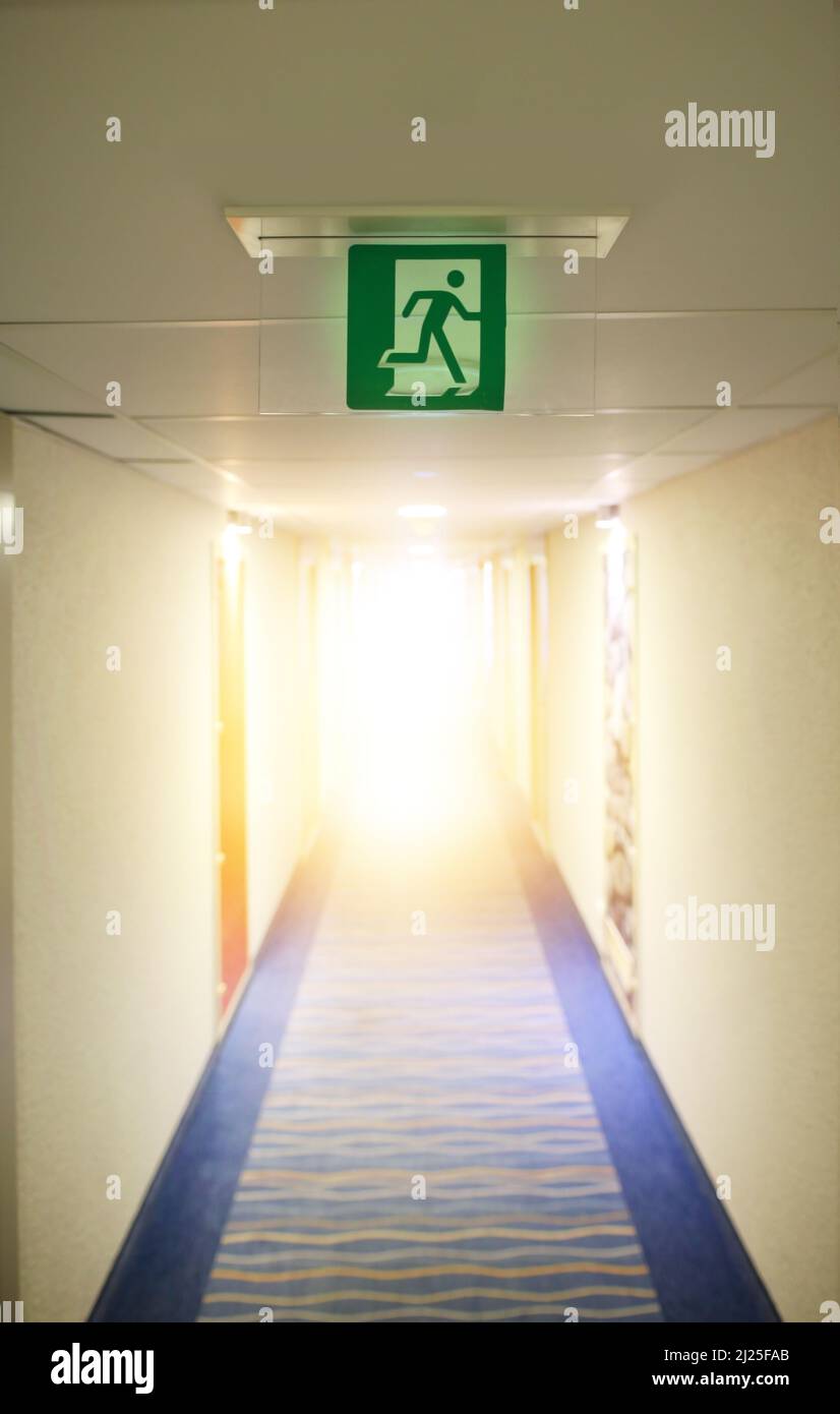 building corridor and emergency exit sign Stock Photo - Alamy
