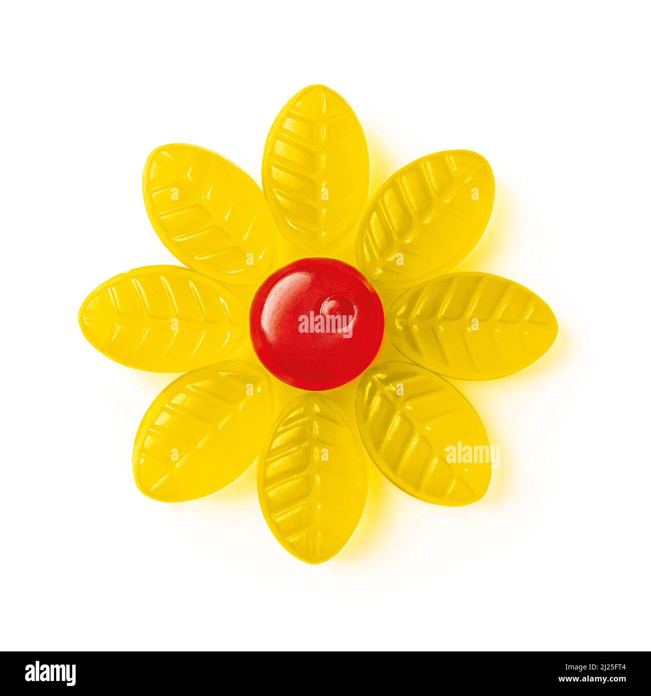 Chewy candy arranged in a flower shape isolated on a white background ...