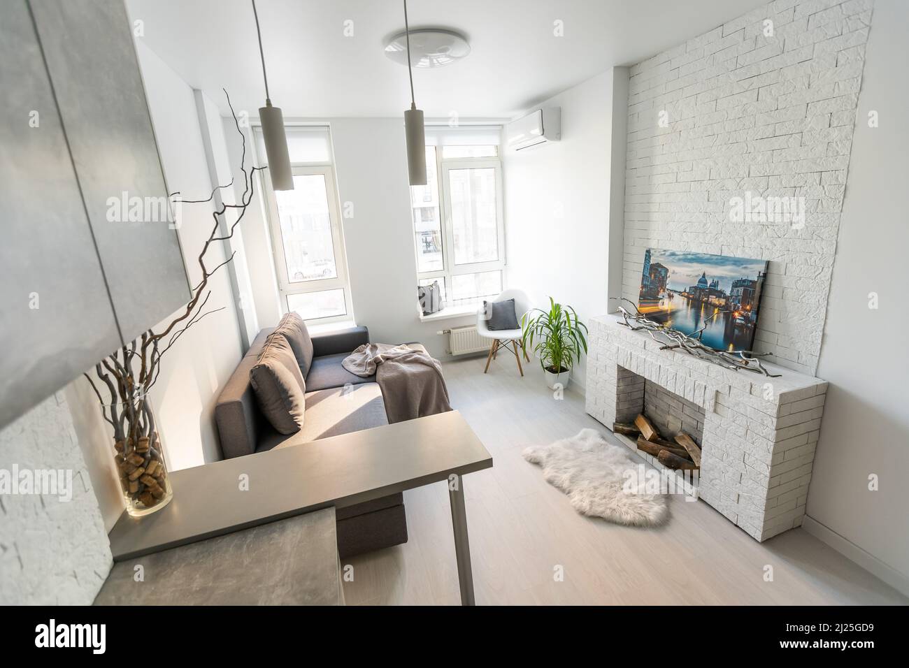 Stylish designed studio apartment with kitchen open to living room and ...