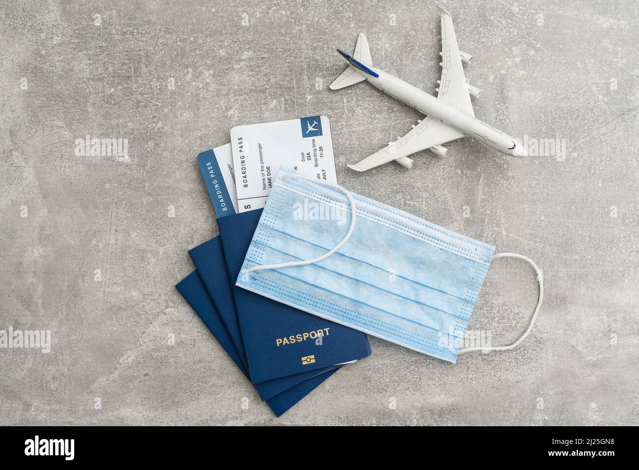 Airplane in flight with a medical mask. Concept - observance of safety ...