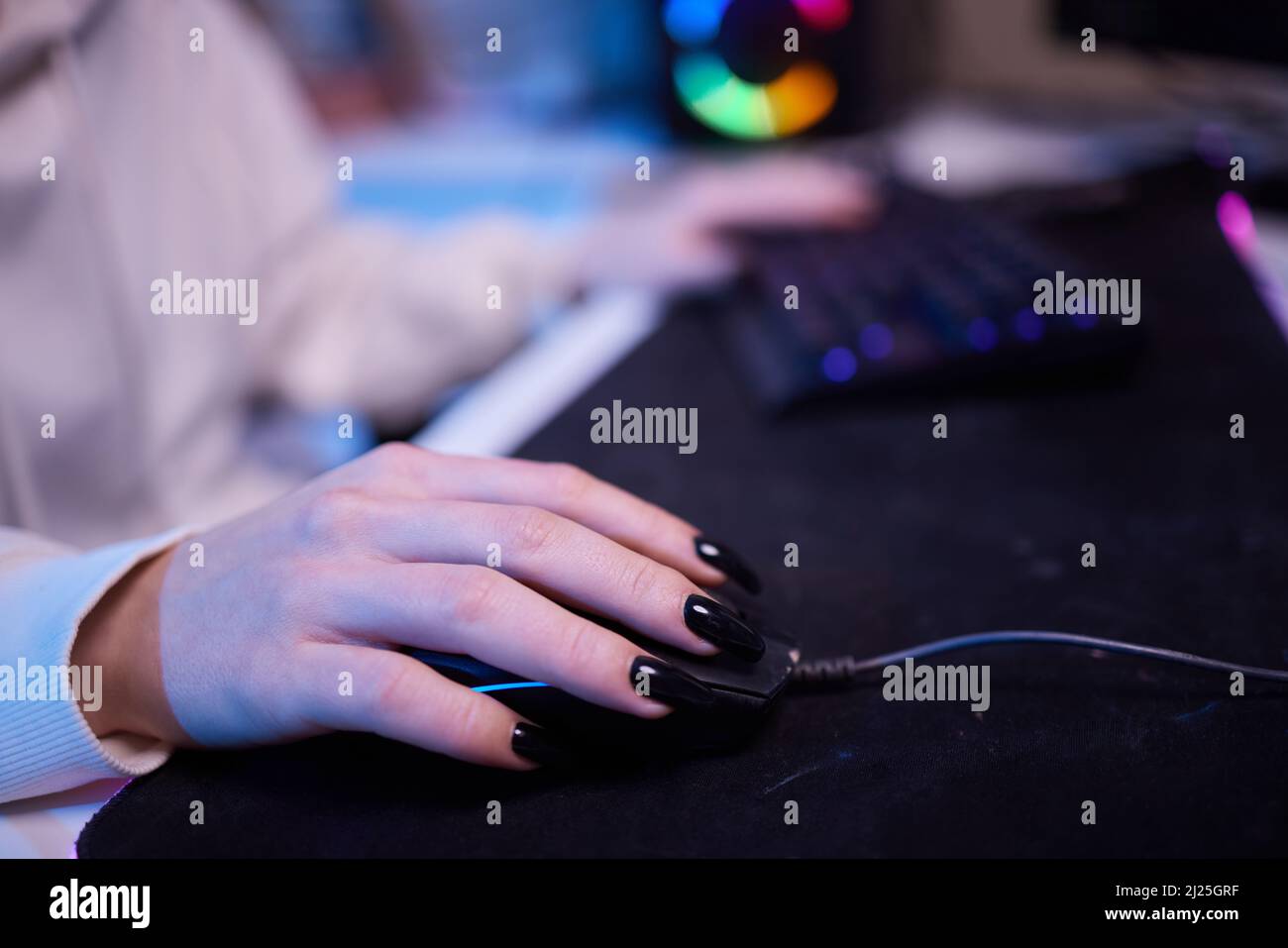 Close-up hands shot asia girl gamer use keyboard and mouse controller ...