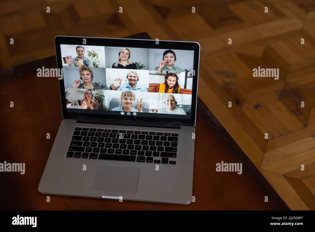 Video Conferencing Call Waving Hello With Hand Stock Photo - Alamy