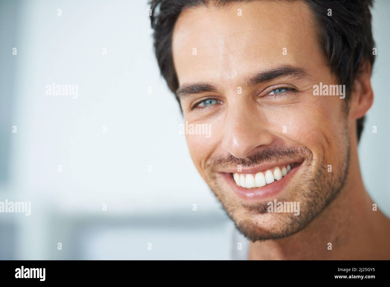 Hes got a winning smile. Closeup portrait of a handsome young man with ...