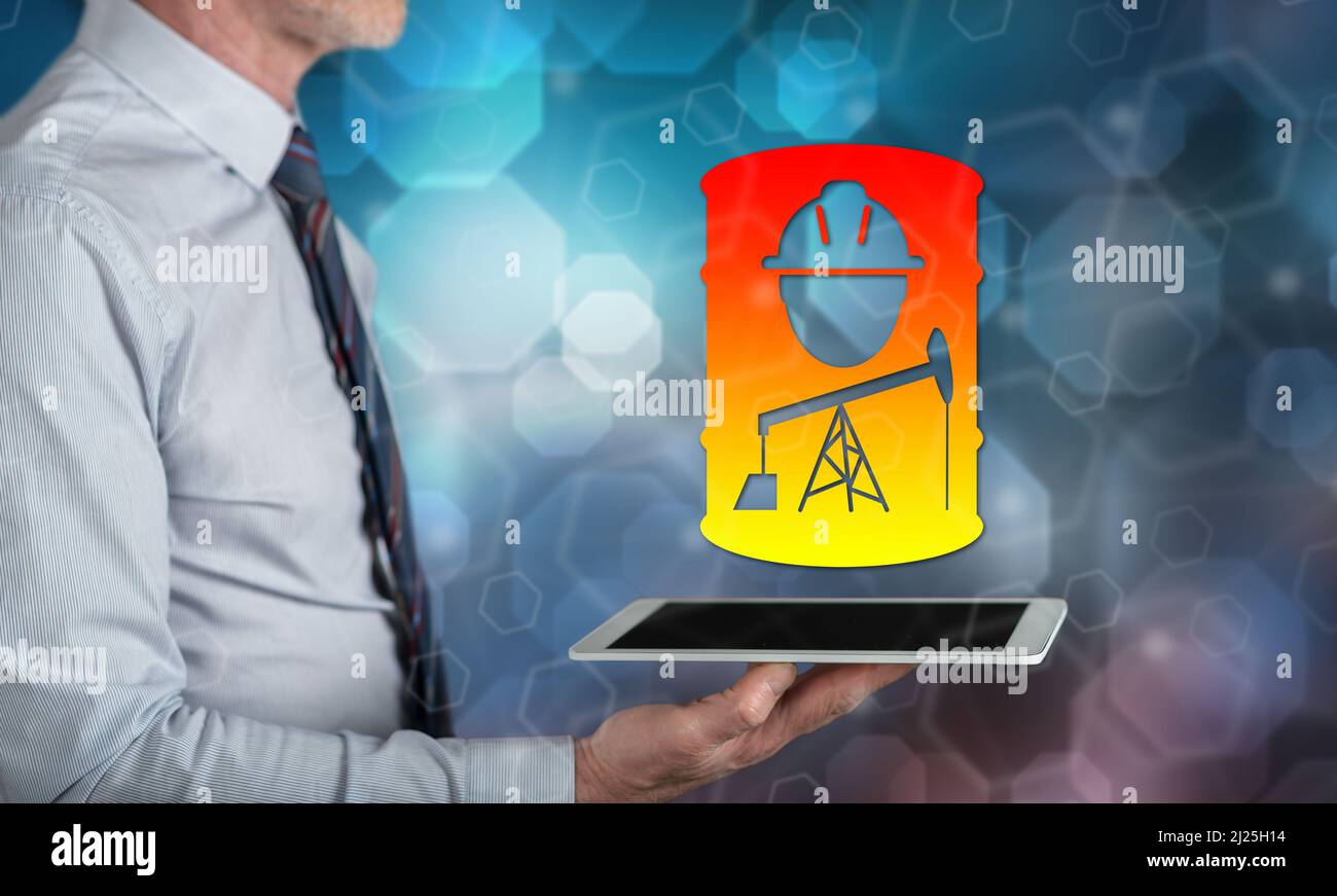 Opec concept above a tablet held by a man Stock Photo - Alamy