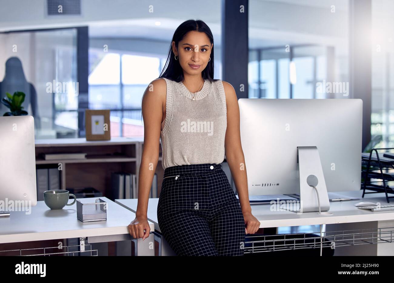 Step into my office. Shot of a young businesswoman in her office Stock ...