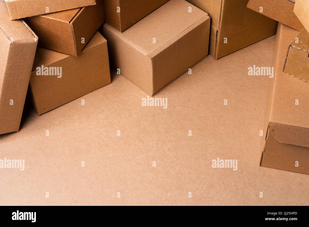 Cardboard box on beige background in studio Stock Photo - Alamy