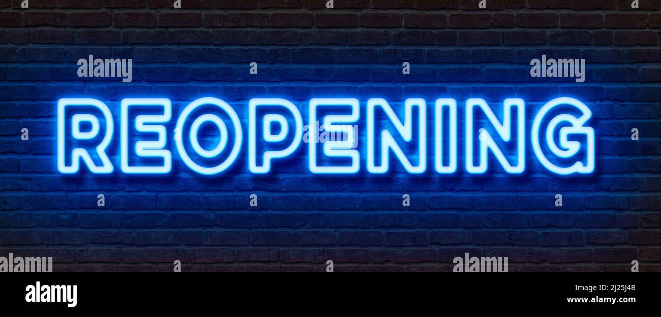 Neon sign on a brick wall - Reopening Stock Photo - Alamy
