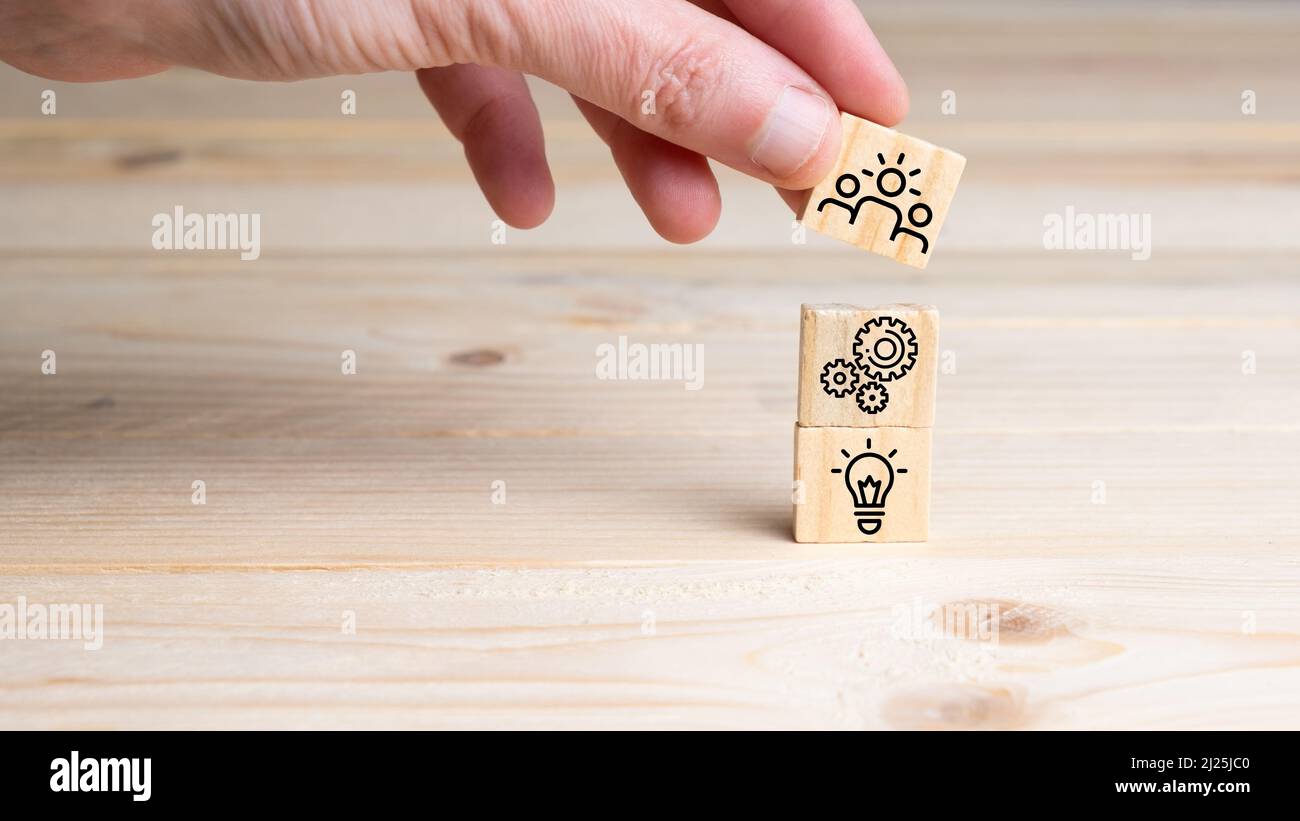 Knowledge sharing and management. Building wood blocks on table Stock ...