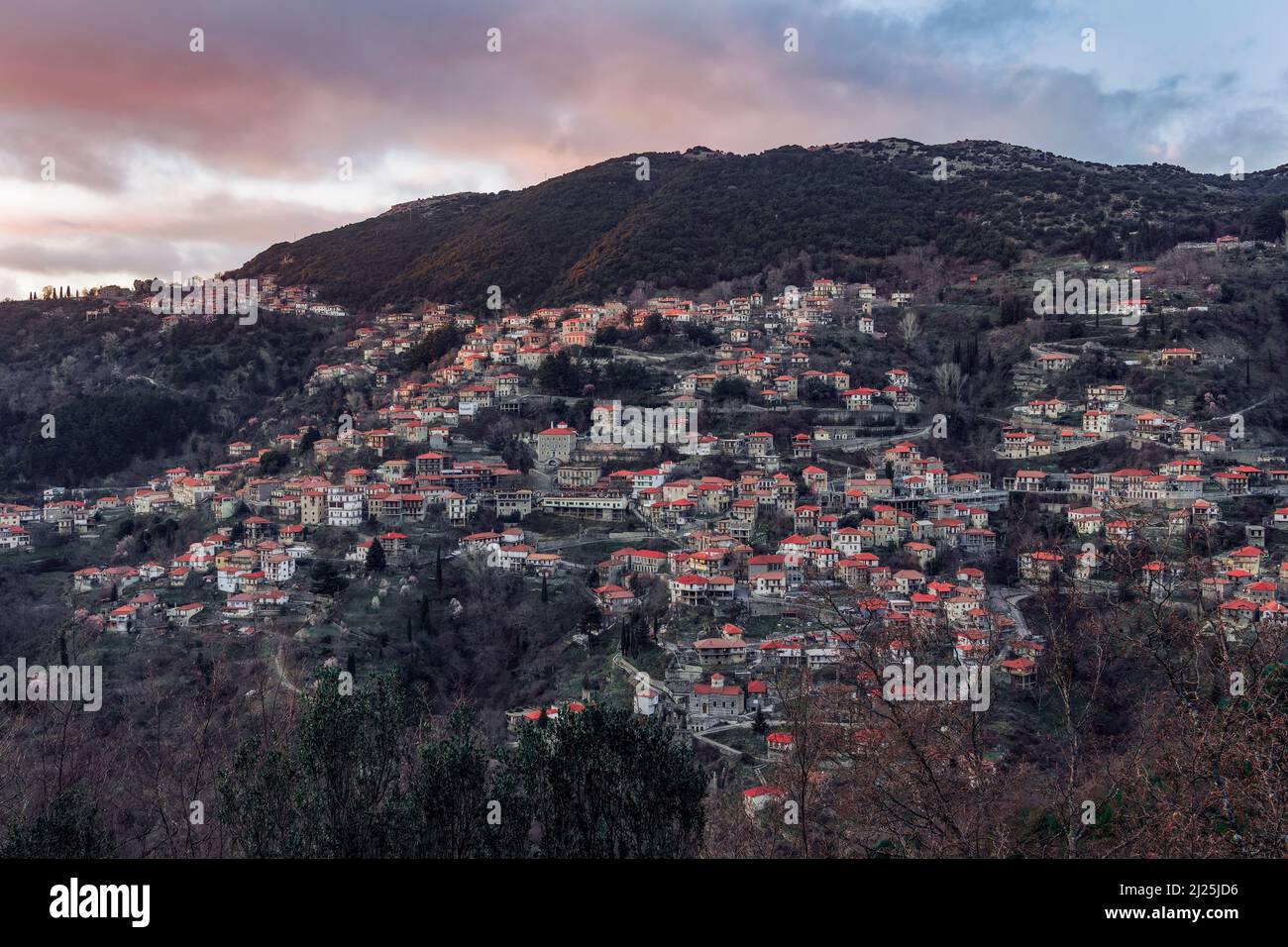 Greek village with traditional low-rise houses panoramic evening ...
