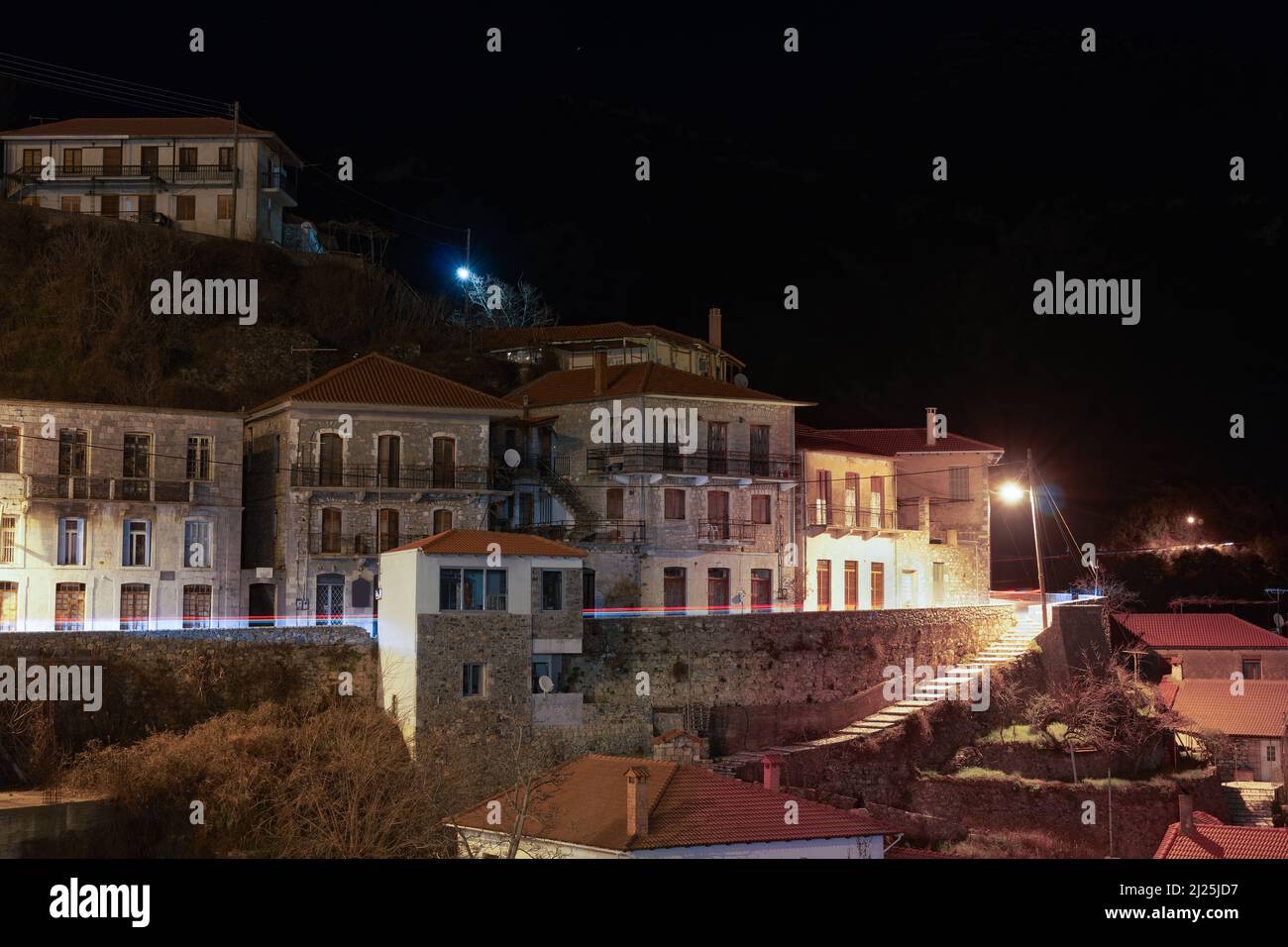 Greek village with traditional stone built houses night view in Lagadia ...