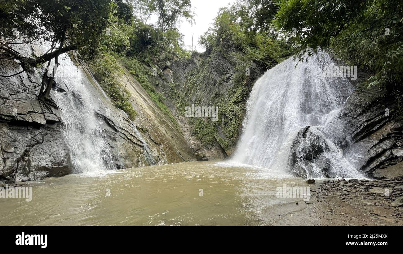 A beautiful view of the Damtua waterfall flowing from the mountains in ...