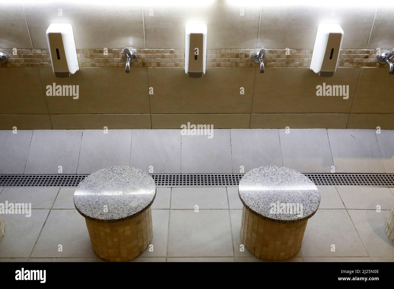 Tap and seat at the ablution fountains in Geneva Mosque Stock Photo - Alamy