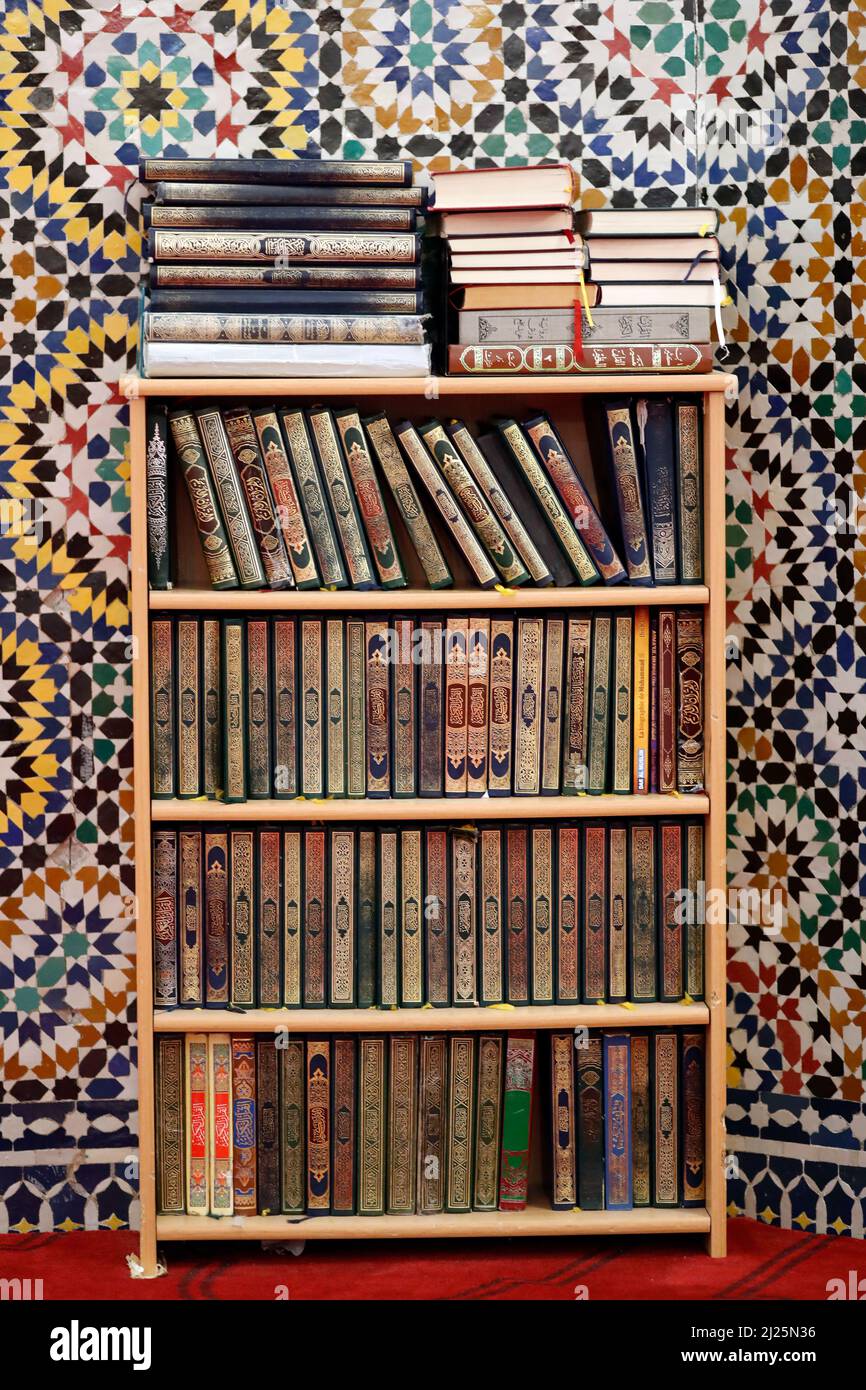 Copies of the Holy Quran on shelves in a Mosque Stock Photo - Alamy