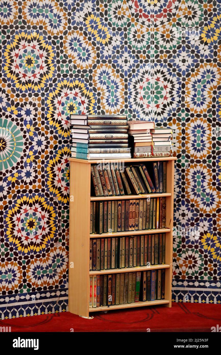 Copies of the Holy Quran on shelves in a Mosque Stock Photo - Alamy