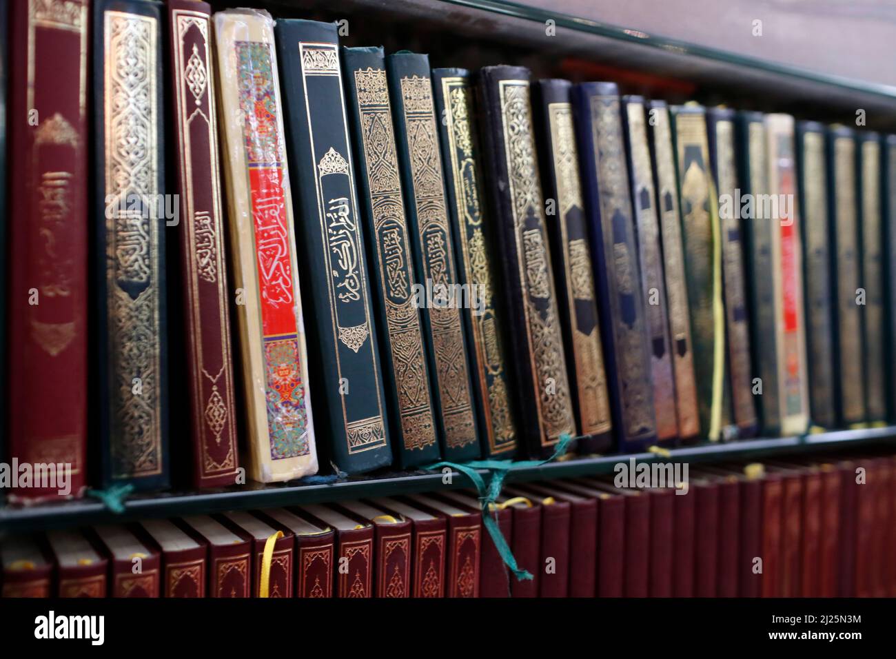 Copies of the Holy Quran on shelves in a Mosque Stock Photo - Alamy