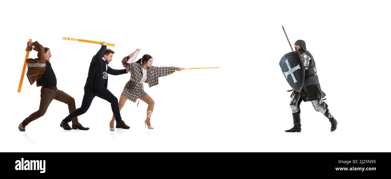 Modern versus medieval. Young male and female office managers and ...