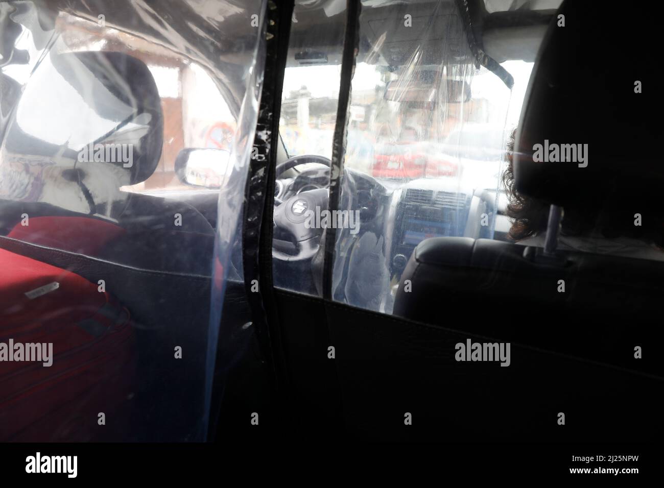 Plastic partition in a taxi during covid-19 epidemic, Ecuador Stock ...