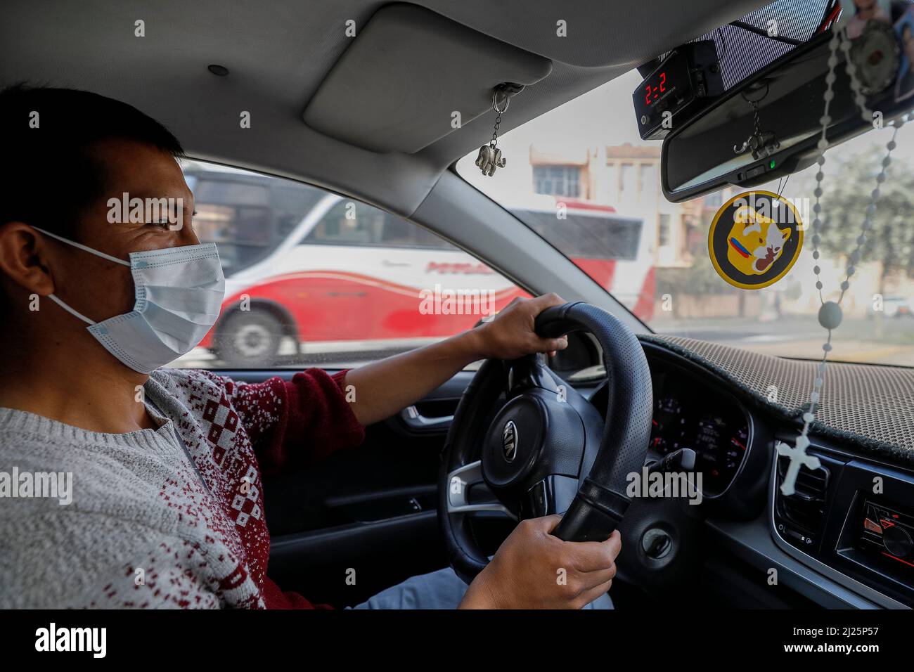 Taxi driver wearing a face mask during covid-19 epidemic, Riobamba ...