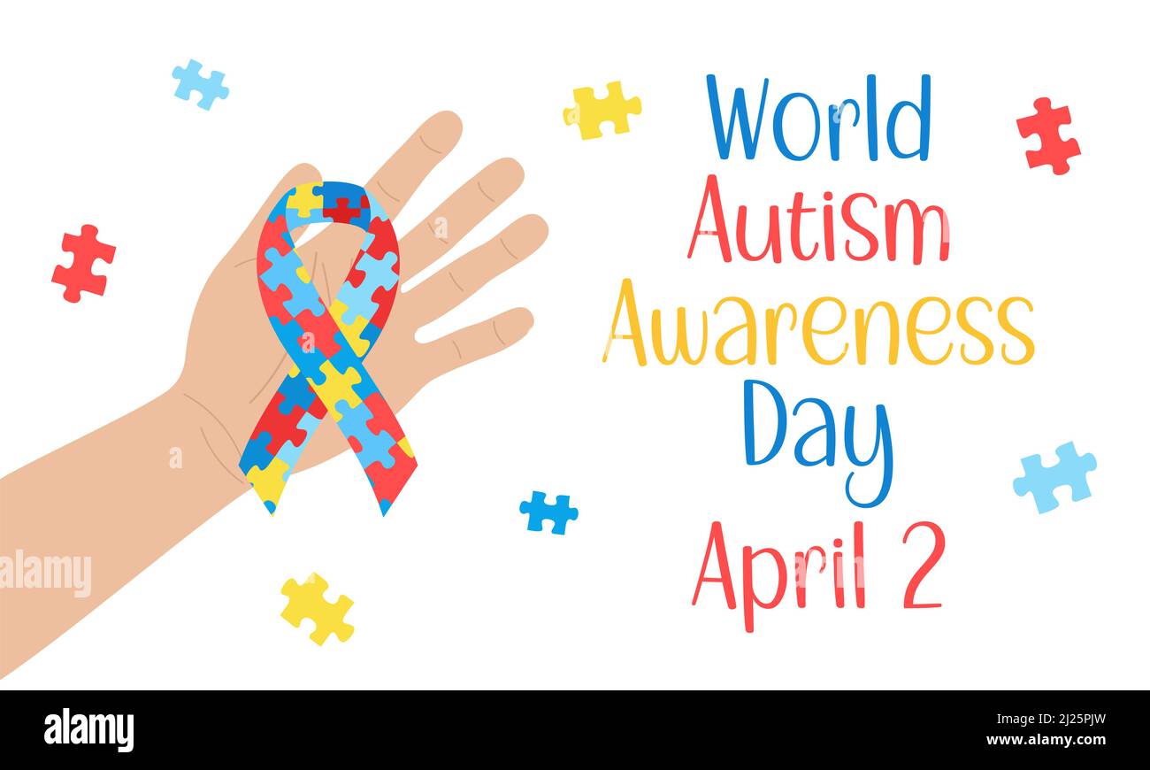 World Autism Awareness Day. Hand holding awareness ribbon with puzzles ...