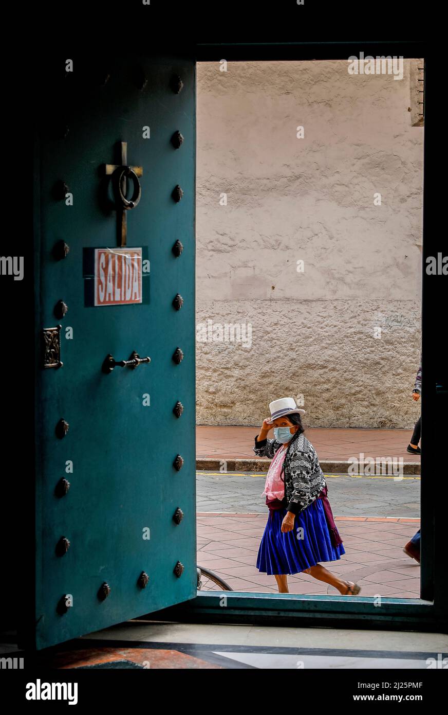 Indigenous woman walking past the Immaculate Conception cathedral ...