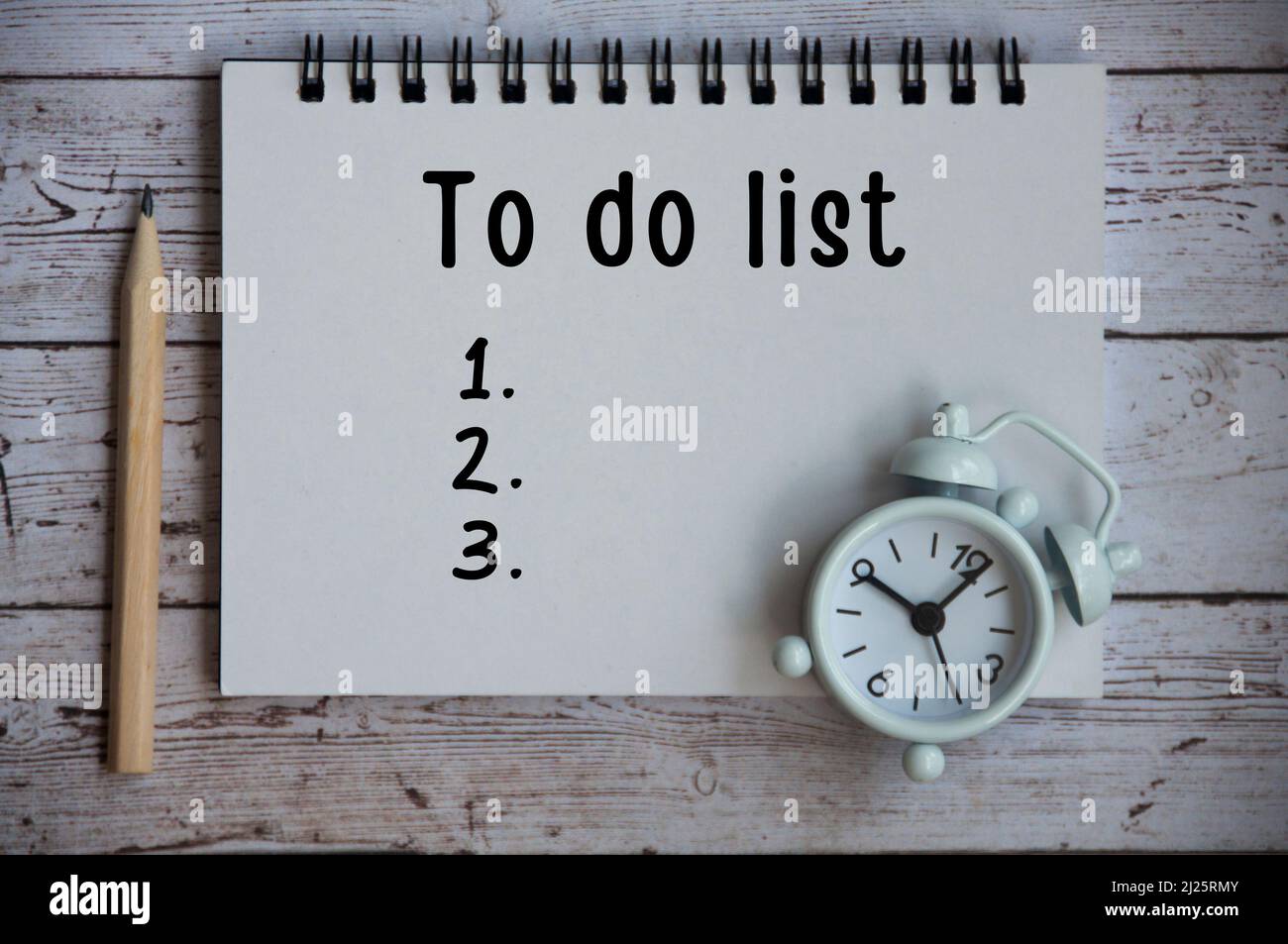 To Do List text on notepad - With white alarm clock and pencil ...