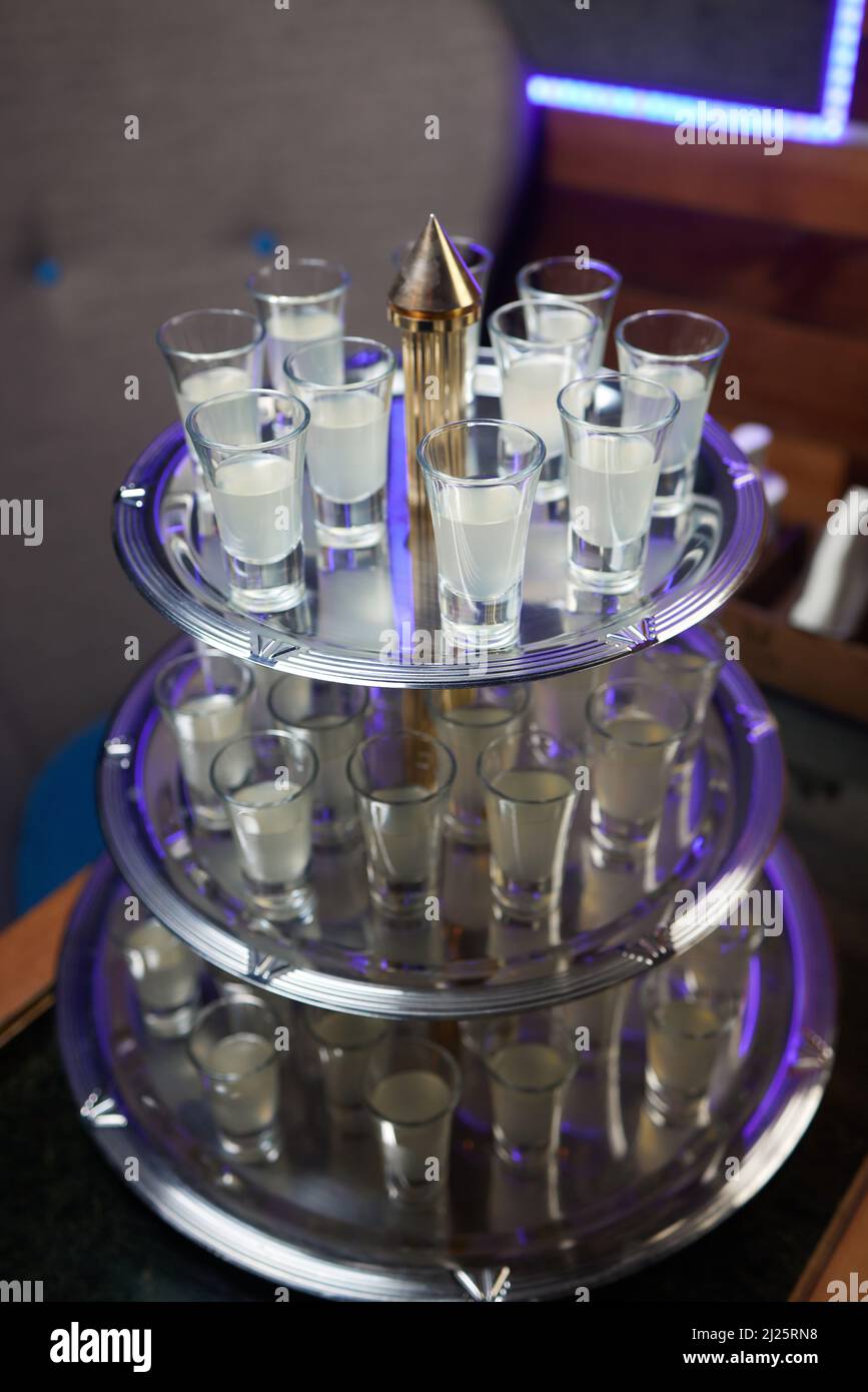 Barman pouring hard spirit glasses hi-res stock photography and images ...