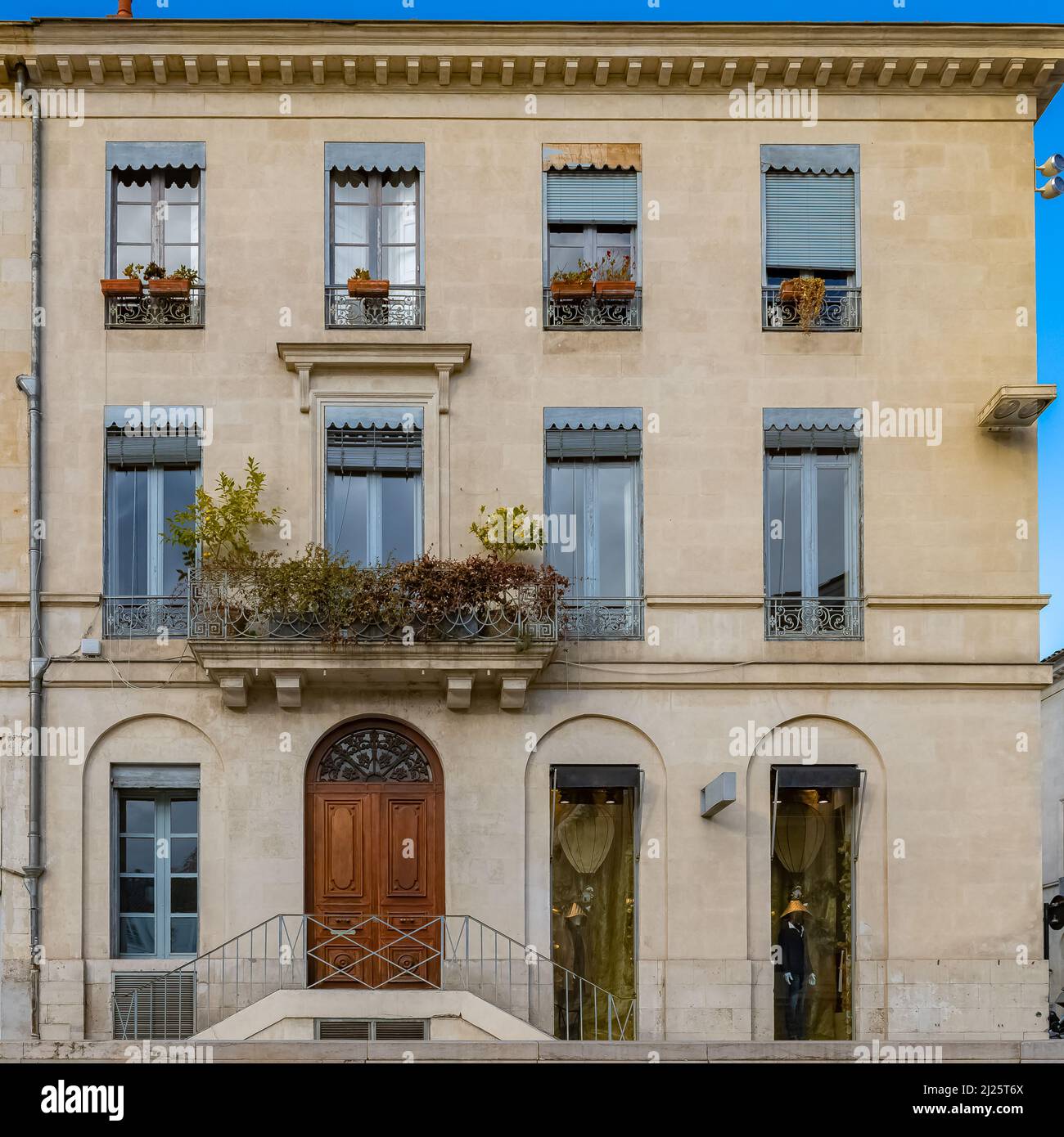 Nimes in France, old facades in the historic center, typical buildings ...